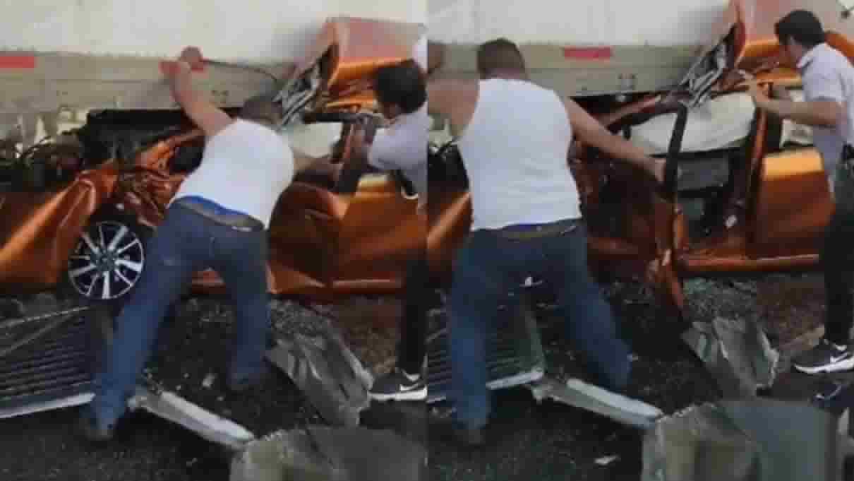 Watch incredible moment driver emerges unscathed from car flattened ...